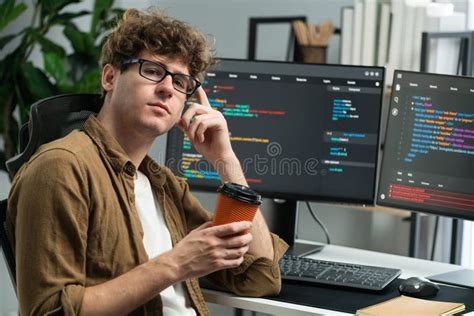It Worker Looking At Camera Holding Coffee Cup At Modern Office Gusher Stock Image Image Of