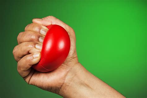 Hand Squeezing Red Stress Ball Photograph By Vishwanath Bhat Fine Art America