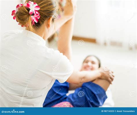 Massage Therapist Is Stretching Women Leg Stock Image Image Of Skin