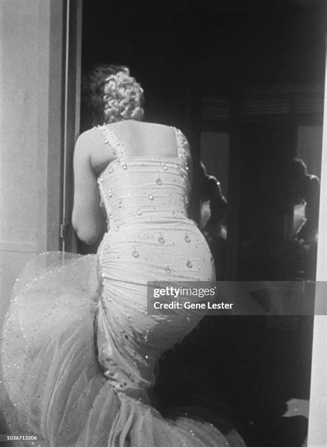 American Actress Marilyn Monroe Wearing A Beaded Gown On The Set Of