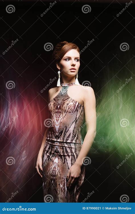 Young Beautiful And Seductive Girl Posing In Dress Stock Image