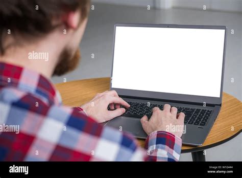 Man Hands Typing On Laptop Keyboard With White Blank Screen Mockup