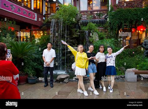 People Take Photos In The Ancient Settlement Of Qabio In The Minhang