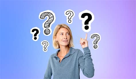 Blonde Woman With Finger Point At Question Marks On Gradient Background