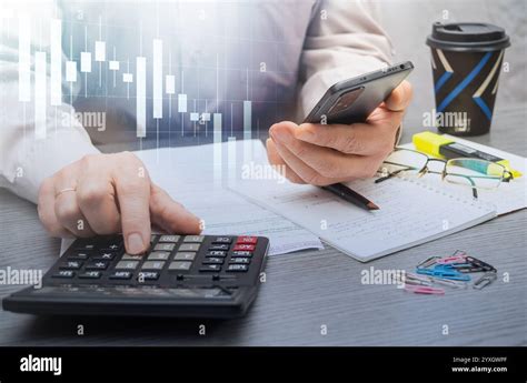 Calculating Expenses And Analyzing Financial Data In A Professional Workspace With Notes And