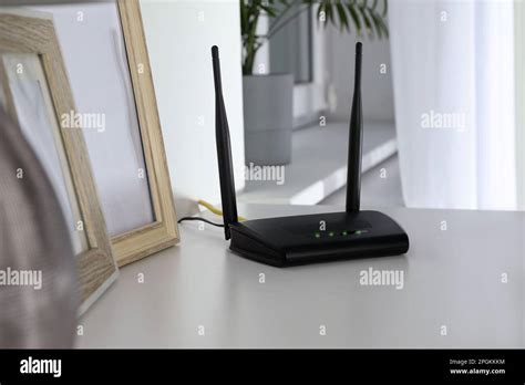 Modern Wi Fi Router On White Table In Room Stock Photo Alamy