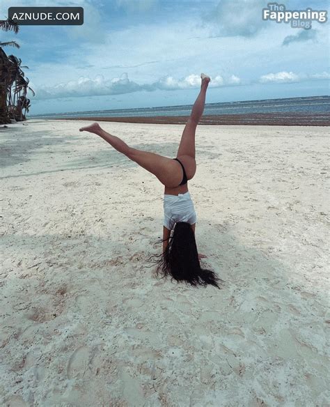 Kim Kardashian Sizzles In Sexy Beach Cartwheels Aznude