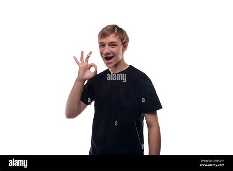 Headshot Portrait Of A Lucky Satisfied Handsome Blond Teenager Guy In A
