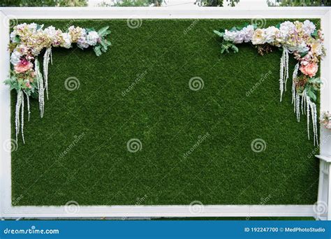 Artificial Grass Wedding Backdrop In A White Frame Decorated With