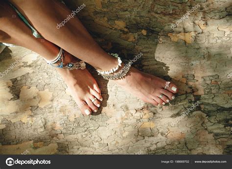Young Woman Bare Feet Tree Surface Boho Style Jewelry Anklets Stock