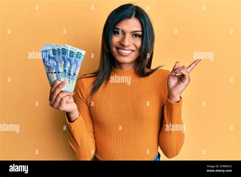 Young Latin Transsexual Transgender Woman Holding South African 100 Rand Banknotes Smiling Happy