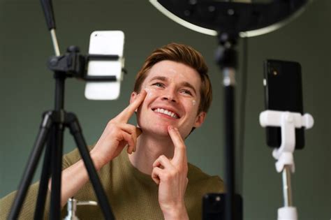 Low Angle Man Applying Face Cream Premium Photo