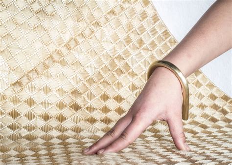 Zsofia Kollar Weaves Human Hair To Create Golden Tapestry