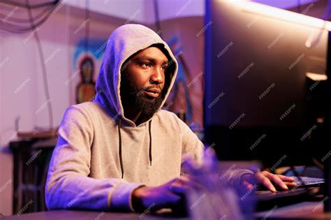 Premium Photo Hacker Cracking Password To Gain Access