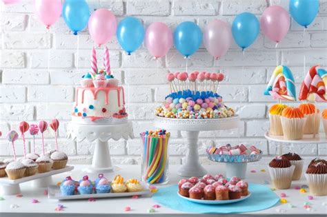 Candy Bar Cupcakes Cakes And Various Sweets Against A White Brick