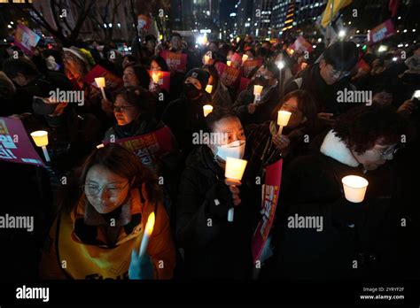 People Hold Candles During A Candlelight Vigil Against South Korean