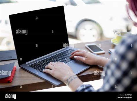 Woman Typing On Notebook With Blank Screen With Copy Space For Your Text Or Advertising Content