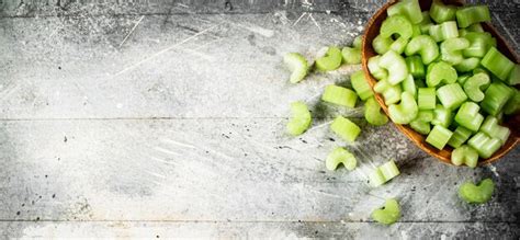 Premium Photo Cut Into Small Pieces Of Celery In A Plate