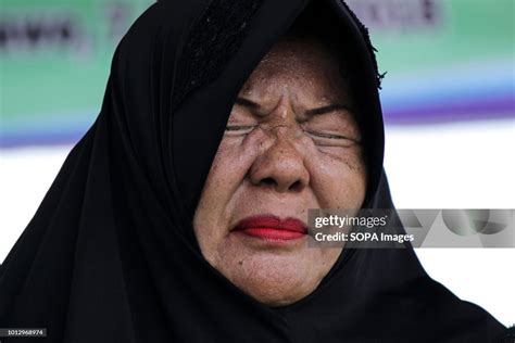 A Woman Seen Being Whipped On The Public Stage Four People Were