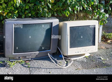 Old Crt Television And Computer Monitor Left On The Pavement For