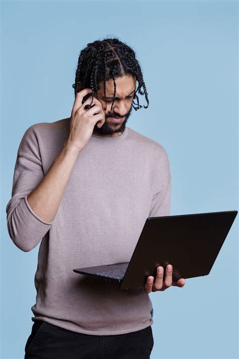 Puzzled Arab Programmer Solving Code Problem On Laptop Stock Image Image Of Business