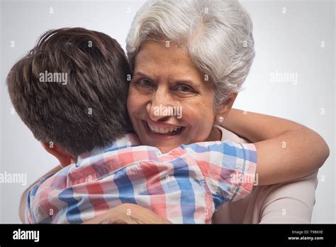 Grandmother Hugging Her Grandson Stock Photo Alamy