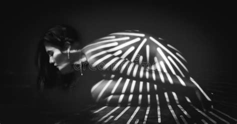 Nude Art Of Naked Woman With Light And Shadow Strip On Dark Background Stock Photo Image Of