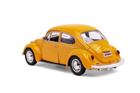 Small Sized German Car Volkswagen Beetle Yellow Color Isolated On White