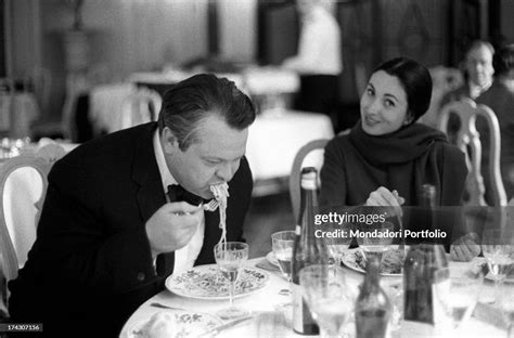 The Us Film Director Orson Welles Eats A Plate Of Spaghetti With