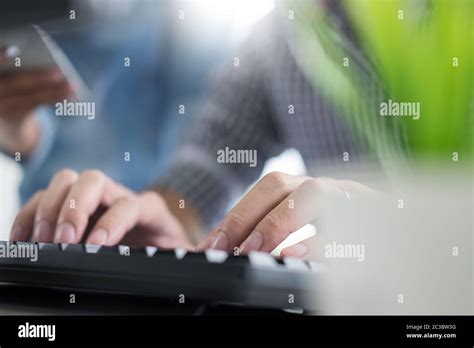 Asian Team Outsource Developer Looking Screen Programming Code Working