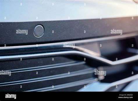 Selective Focus On Parking Sensor Of Parking Assistent System At Front Of Luxurious Car Bumper