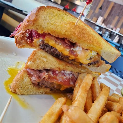 Burger With Fried Egg Bacon And Cheese On Buttered Toast Instead Of Regular Buns Dining And