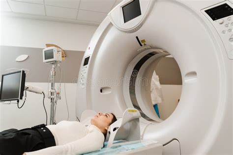Girl Patient Is Doing Computed Tomography X Ray Examination Of Tumor In His Head In A Ct Scan