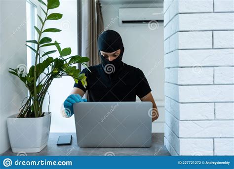 Hacker Man In Black Using Computer Laptop For Criminal Activity Hacking