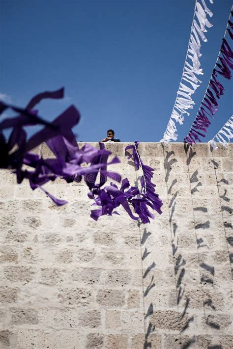 Man Assembling The Decoration For Catholic Celebrations At The Top Of