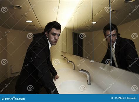 Vain Business Man Checking His Looks In The Mirror Royalty Free Stock
