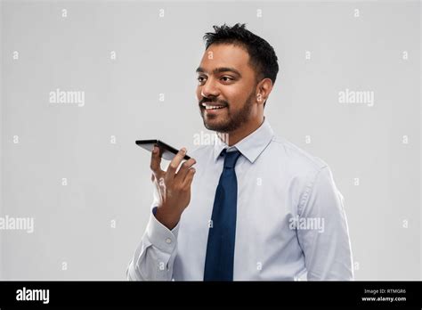 Businessman Using Voice Command On Smartphone Stock Photo Alamy
