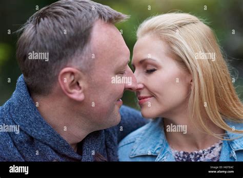 Mature Couple Kissing Outside Stock Photo Alamy
