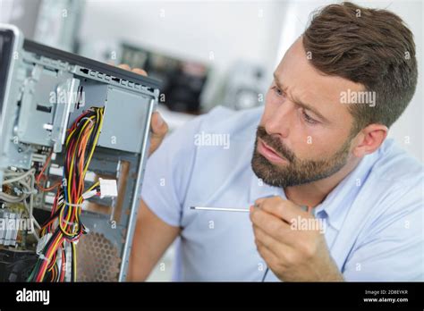Man Assembling Computer With Screw Stock Photo Alamy