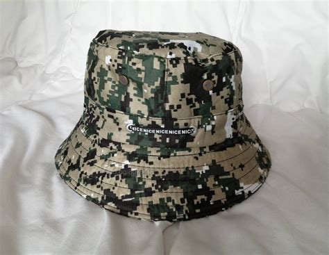 Камуфлажна шапка идиотка Аксесоари Монтана Камуфлажна рибарска шапка тип ”идиотка” с