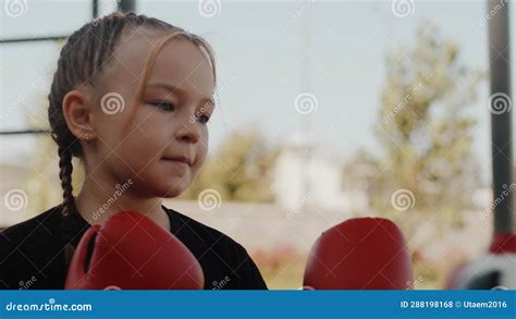 Young Caucasian Girl In Boxing Gloves Close Up Hitting And Dodging Her