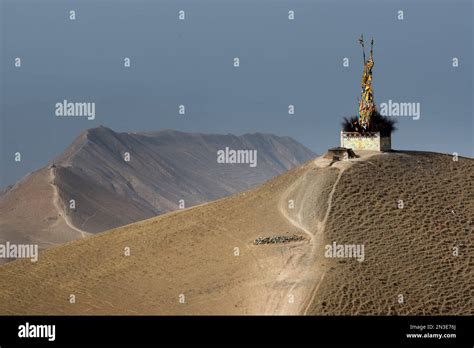 Tower Of Buddhist Prayer Flags On A Sandy Mountaintop At Labrang