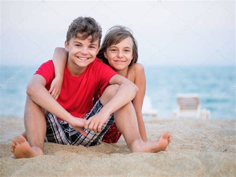 Brother And Babe Playing On Beach Stock Photo VaLiza 188388862