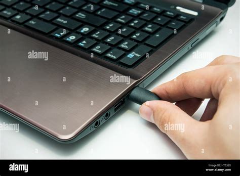 Hand Connecting Usb Cable To Laptop Stock Photo Alamy