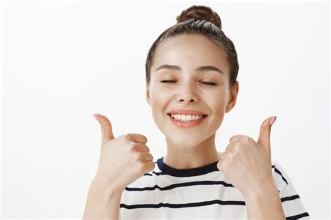 Free Photo Close Up Of Fully Satisfied Happy Attractive Girl Smiling With Closed Eyes And