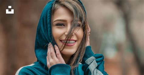 Smiling Woman Wearing Blue Hoodie In Selective Focus Photography Photo Free Fateh Garden Image