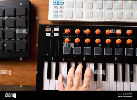 Musicians Hand On Midi Keyboard Modern Musical Equipment For