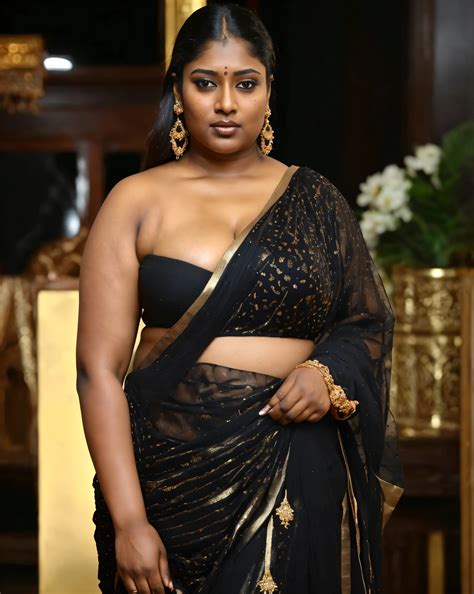 A Close Up Of A Woman In A Black Sari Posing For A Picture Seaart Ai