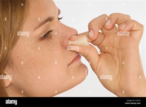 WOMAN WITH NOSEBLEED Stock Photo Alamy