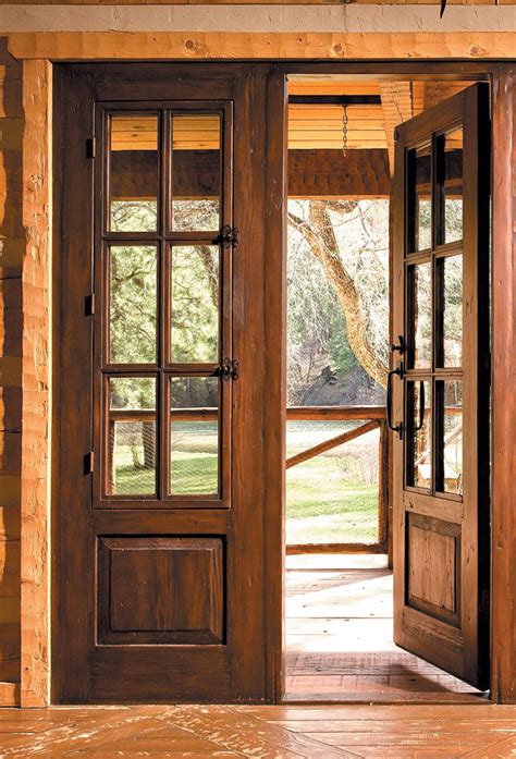 Cozy Cabin With Welcome Sign And Potted Plant French Doors For Log